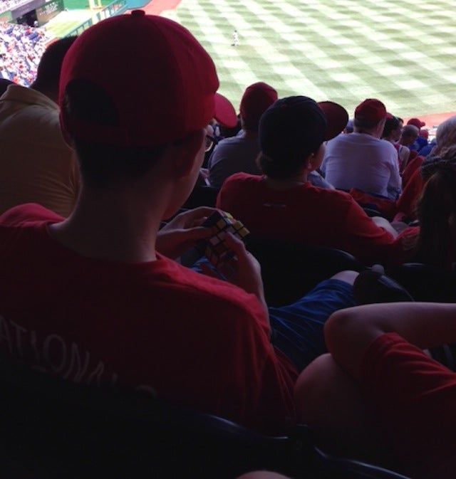 Deadspin | Here's A Bored Baseball Fan Playing With A Rubik's Cube