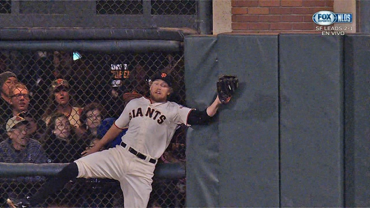 Deadspin | Hunter Pence Slams Into Fence To Rob Jayson Werth Of A Hit